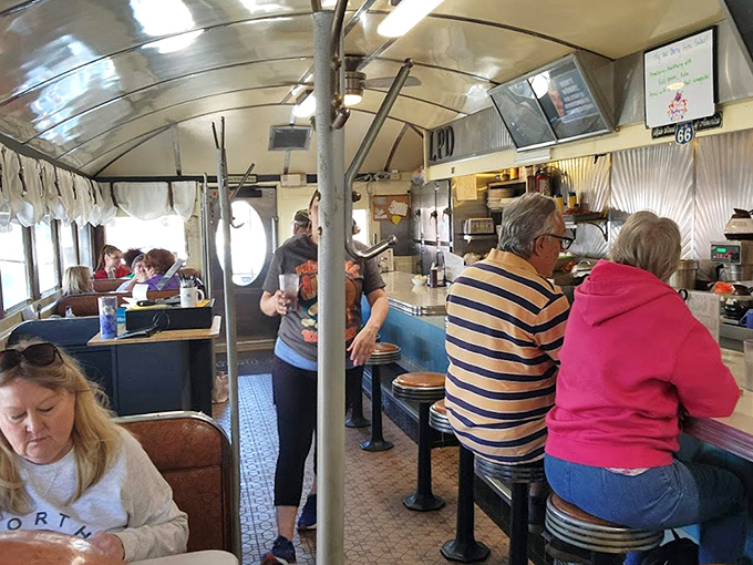 The breakfast crowd in their natural habitat – where strangers become friends over shared appreciation for real diner food.