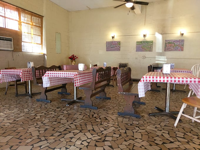 The dining room whispers stories of decades of satisfied customers who came for lunch and left with memories etched in barbecue sauce.