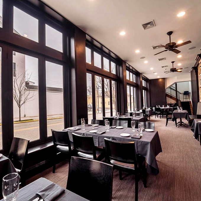 Floor-to-ceiling windows flood the dining room with natural light, making it the perfect stage for food that deserves the spotlight.