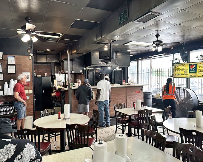 The dining room: where strangers become friends united by sauce-stained shirts and the mutual understanding that silence means it's delicious.