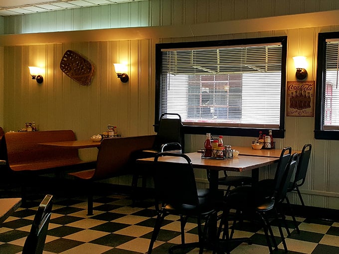 Vintage charm meets practical comfort in a dining room where the ceiling fans have witnessed decades of local gossip.