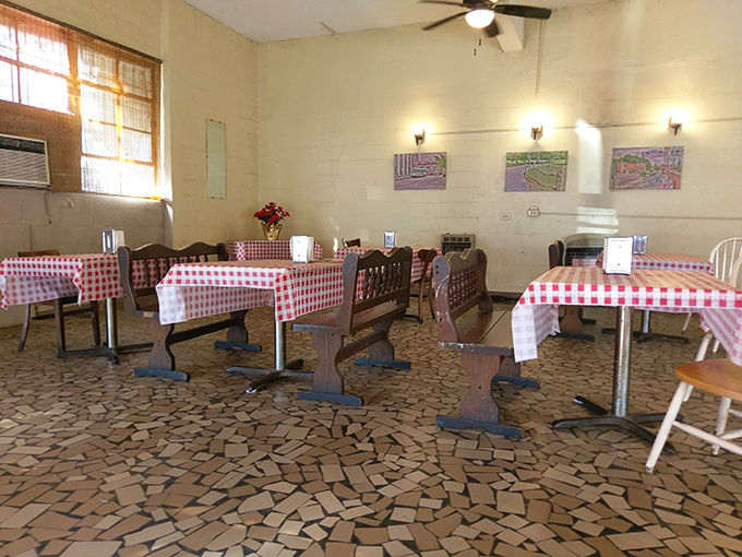 The dining room whispers stories of decades of satisfied customers who came for lunch and left with memories etched in barbecue sauce.