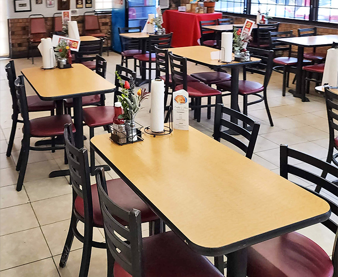 Simple tables, burgundy chairs, and paper towel rolls at the ready&mdash;because when the chicken's this good, napkins just won't cut it.