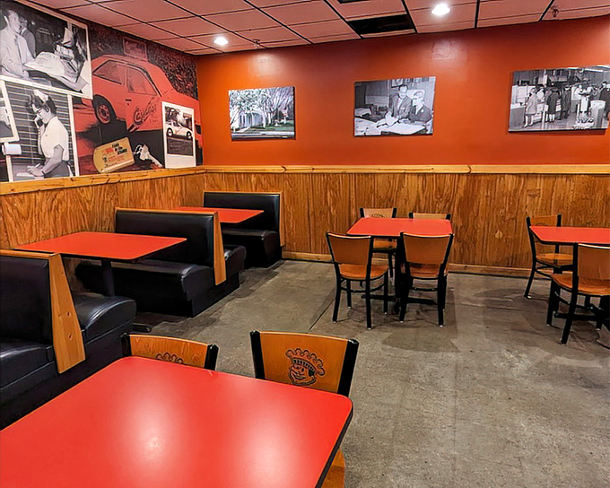 The dining area's red tables and wooden booths offer the perfect setting for pizza communion – unpretentious, comfortable, and focused on what matters.