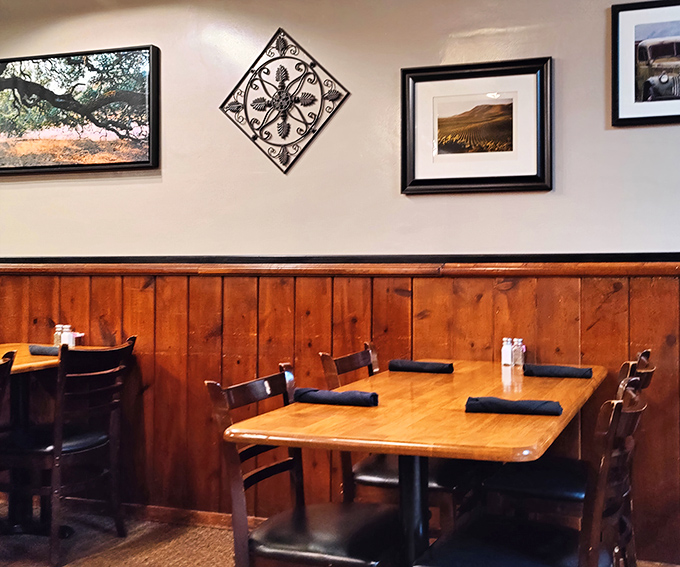 Simple tables, wood paneling, and framed landscapes&mdash;because when the steak is this good, you don't need distractions.