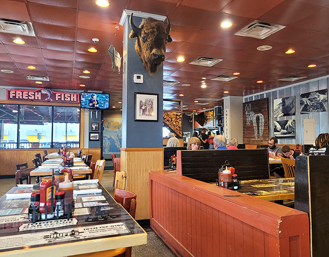 The dining room where memories are made, one smoky bite at a time. That buffalo head has seen some serious eating.
