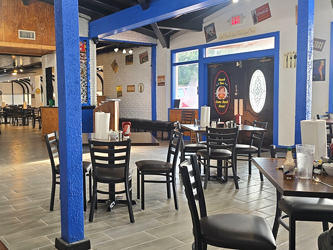 Empty tables never stay that way for long in this dining area, where the blue pillars have witnessed countless first bites and satisfied sighs.