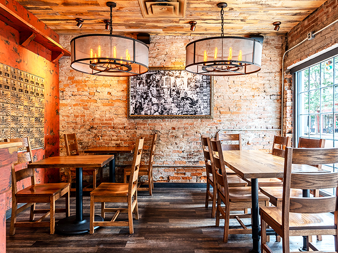 Edison bulbs cast a warm glow over brick walls and wooden tables, creating the perfect lighting for both your meal and your Instagram feed.