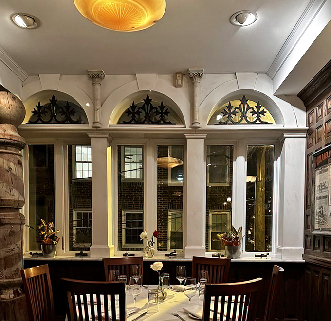 Dining by these arched windows feels like you've scored the best table in Philadelphia. The architectural details whisper stories of celebrations past.