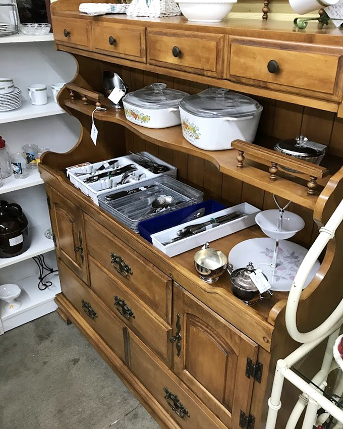 Grandmother's china cabinet, reincarnated and waiting for a new home. Those Corningware casseroles have witnessed countless family dinners and holiday gatherings.