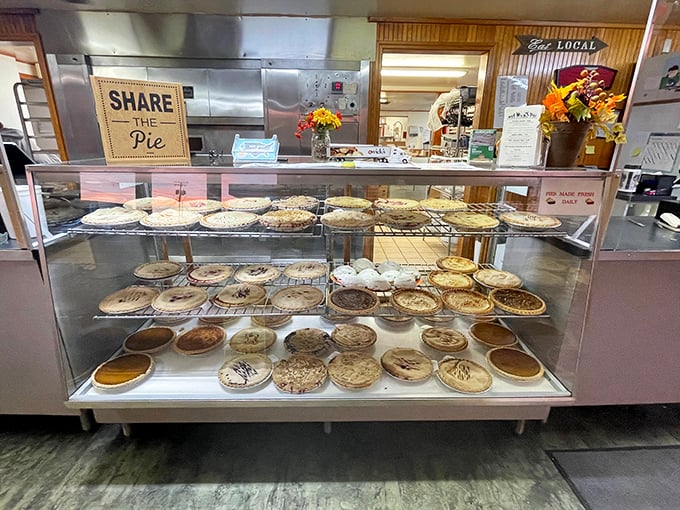 The pie display case&mdash;a museum of edible art where every piece deserves its own moment of silent appreciation.
