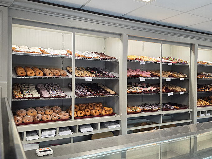 A donut display that makes adult self-control evaporate faster than morning dew on a summer sidewalk.