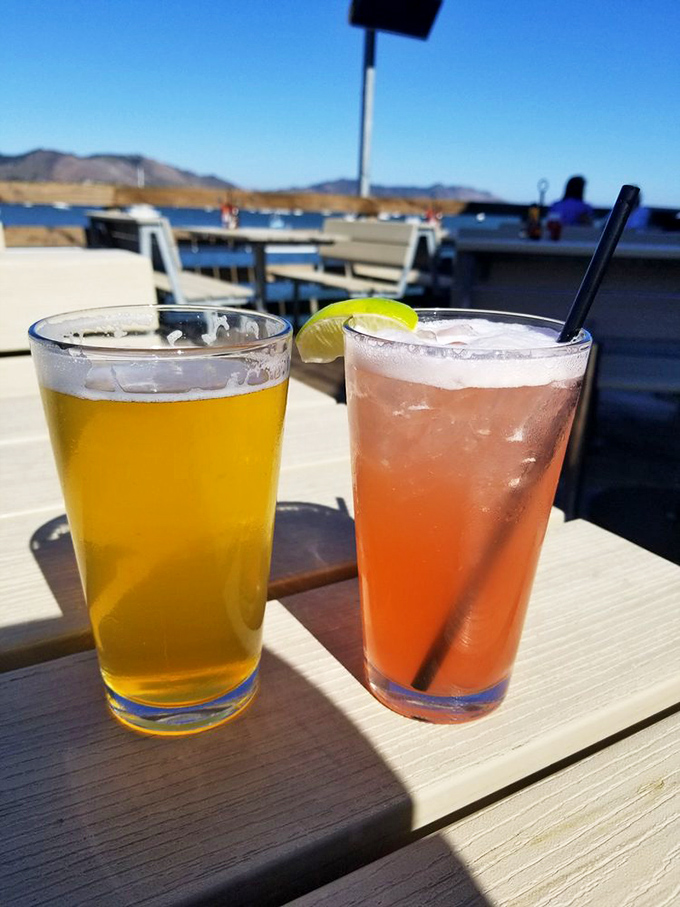 Cold beer and a sunset-colored cocktail&mdash;because hydration is important when you're busy solving the world's problems from a pier-side table.