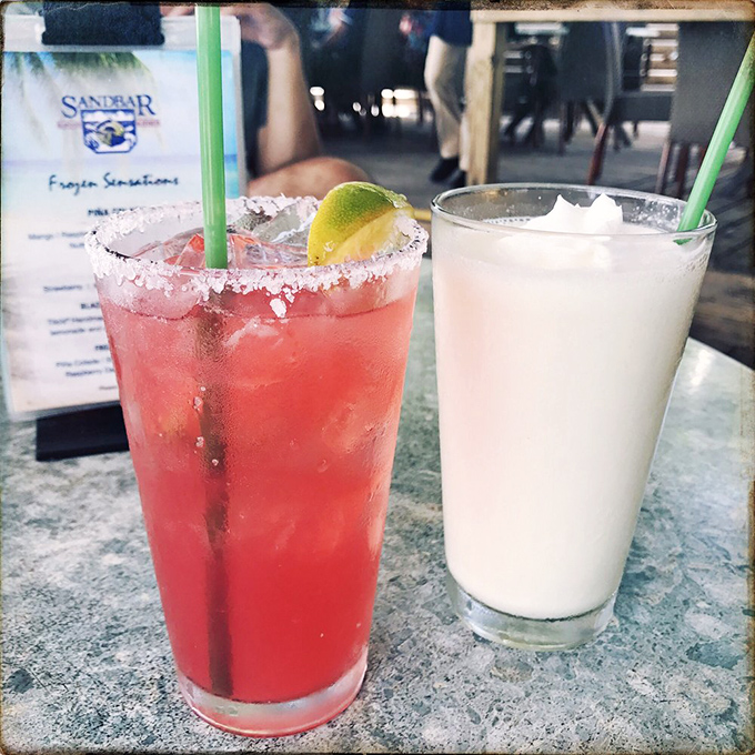 Cocktails so pretty they deserve their own social security numbers. That pink beauty is calling your name louder than retirement.