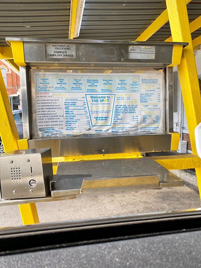 The drive-thru menu board&mdash;a beacon of hope for those too hungry to leave their cars, promising satisfaction without the inconvenience of walking. 