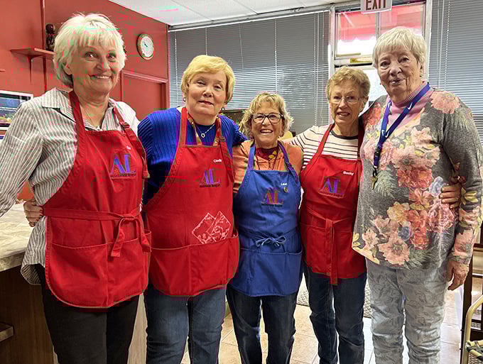 These apron-clad volunteers are the curators of chaos, transforming mountains of donations into organized departments of affordable possibilities.