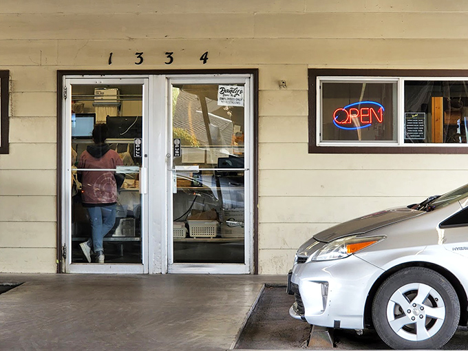 The entrance beckons with humble charm, giving no hint of the portion-sized adventures that await just inside.