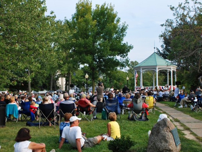 Summer concerts at the gazebo gather the community like a family reunion where everyone actually likes each other.