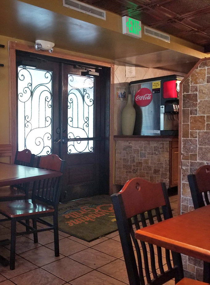 Wrought iron details on the doors add unexpected elegance to a place that balances casual charm with thoughtful touches.