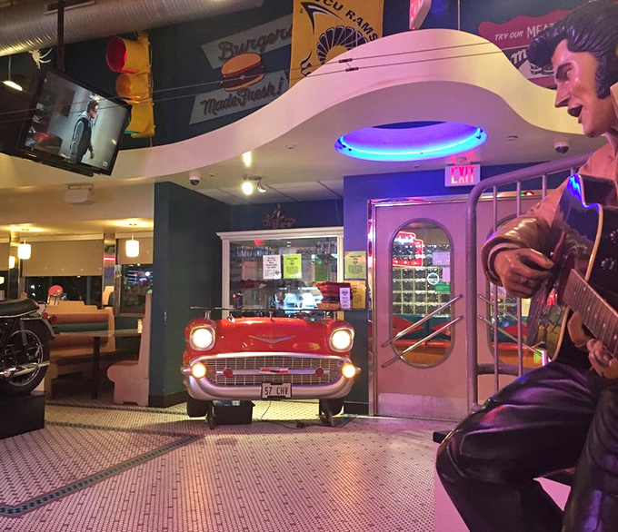 The retro interior features classic Americana touches like Elvis memorabilia and a vintage car front&mdash;proving nostalgia tastes better with good food.