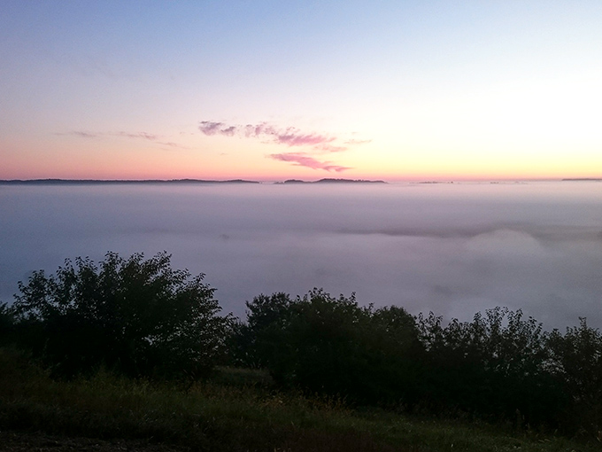 Morning fog blankets the valleys like nature's cotton candy, turning hilltops into islands in a mystical sea that vanishes by brunch.