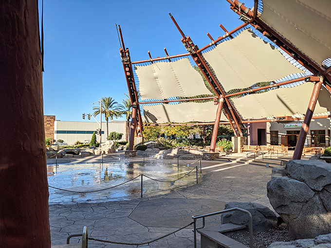 The center's stunning tensile shade structure and water feature create an oasis amid retail therapy. Desert shopping doesn't mean desert conditions.