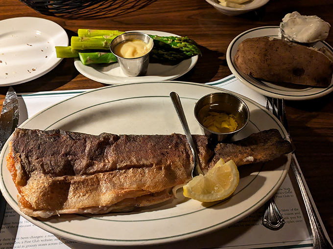 This isn't just fish&mdash;it's aquatic perfection with a golden crust, proving The Pine Club's mastery extends beyond the pasture to the sea.