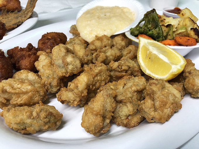 Fried oysters wearing golden jackets like they're headed to some fancy oceanic awards ceremony.