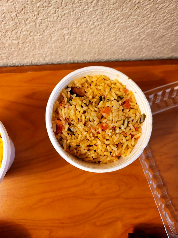 BBQ rice that's absorbed the essence of Texas smoke – each grain telling a delicious story of transformation from simple to sublime.