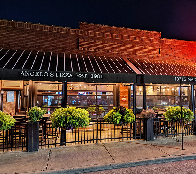 By night, Angelo's transforms into a beacon of brick-oven brilliance—where patio dining under string lights feels like a scene from your favorite food movie.