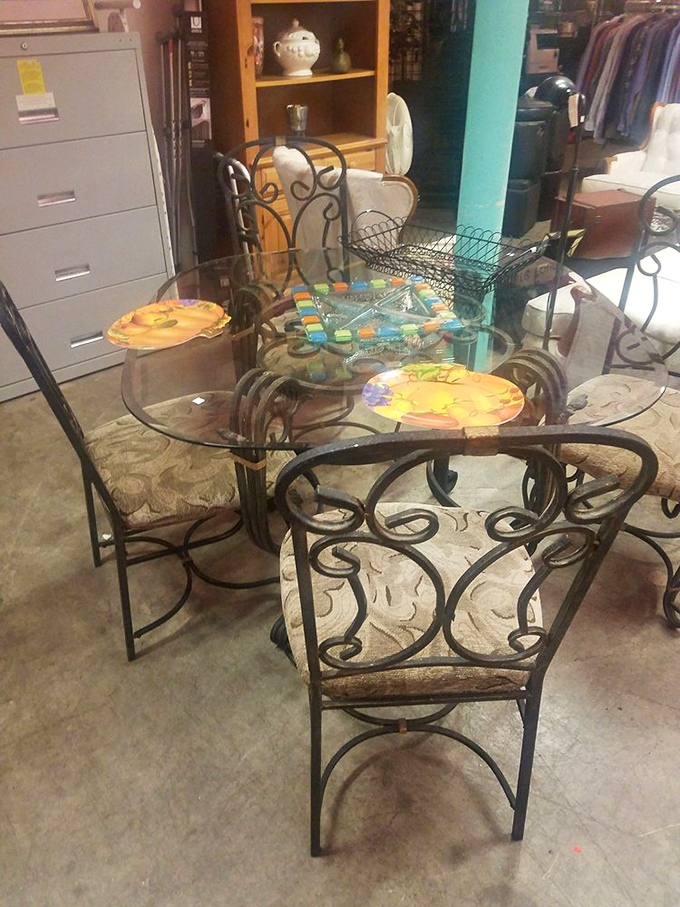 Wrought iron meets glass in this dining set that somehow bridges rustic charm and urban sophistication. Dinner party, anyone?