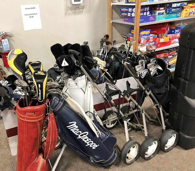 Golf bags lined up like eager caddies, each one hoping you'll take them for another round on the greens.