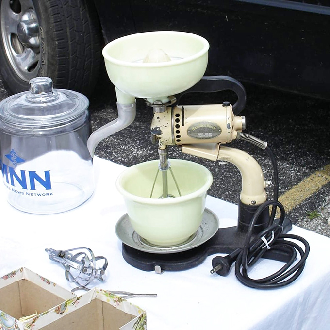 That jade-colored mixer isn't just kitchen equipment &ndash; it's a mechanical time capsule from when baking was an arm workout.