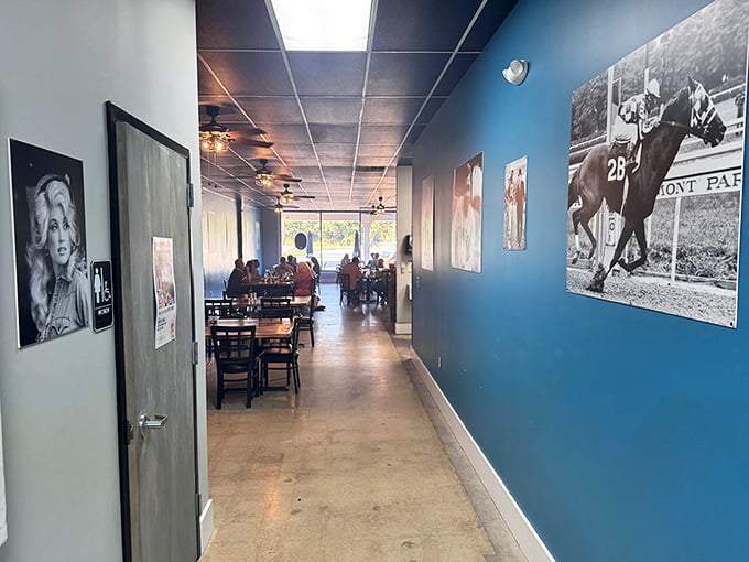 The hallway gallery walk &ndash; where legends of music and sport watch over diners. Blue walls create the perfect backdrop for black and white memories.