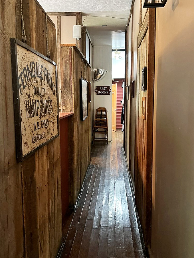 This narrow hallway has guided more hungry patrons to happiness than a self-help book. The vintage sign whispers stories of yesteryear.