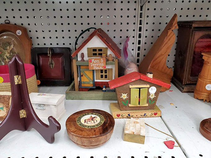 Whimsical wooden houses and trinket boxes that prove one person's "what is this thing?" is another's perfect bookshelf accent.
