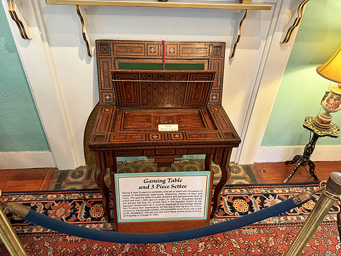 This gaming table hides more secrets than a poker player's face. The inlaid patterns and hidden compartments speak to evenings of genteel gambling.