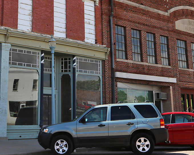 These brick-paved streets have weathered a century of Nebraska seasons, still carrying the town's traffic with stubborn prairie resilience.