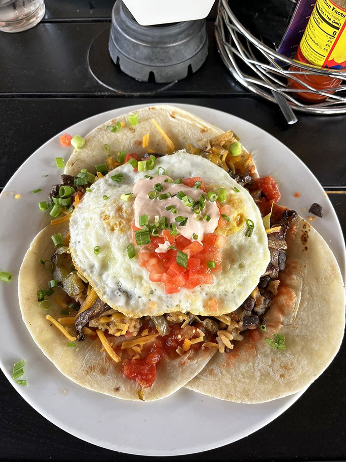 Huevos rancheros reimagined as a colorful fiesta on a plate, where eggs, tortillas, and fresh salsa come together in perfect harmony.