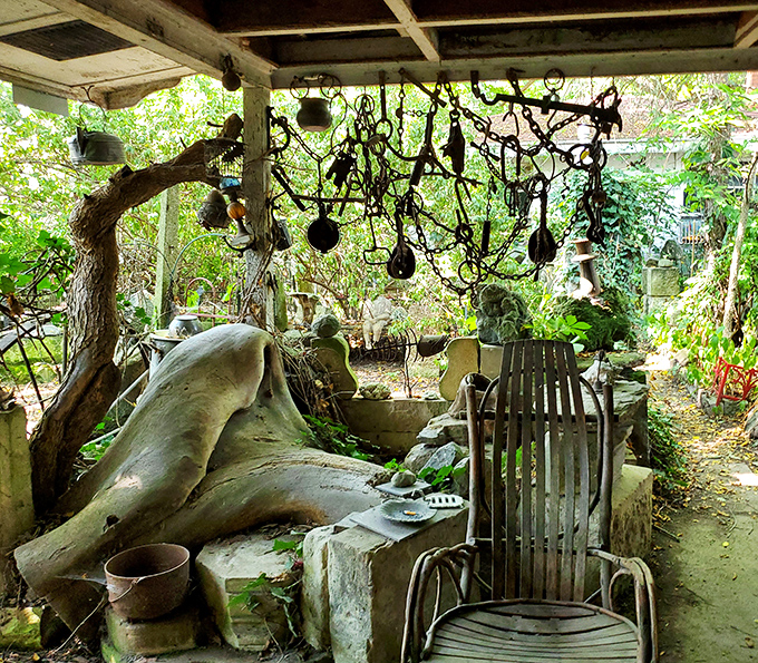 Everyday objects transform into art under this rustic shelter. Suspended pots and pans become wind chimes in this creative sanctuary.