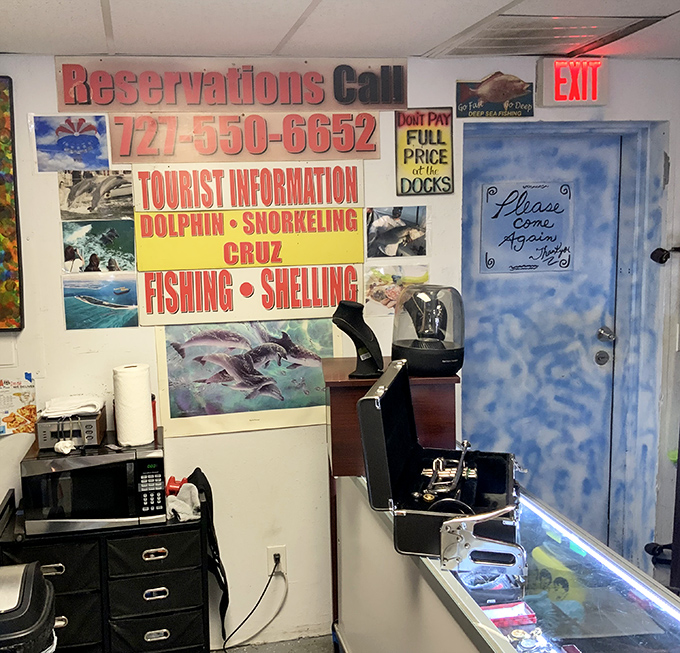 The tourist information wall creates a delightful "what exactly am I looking at?" moment &ndash; part thrift store, part vacation planning center.
