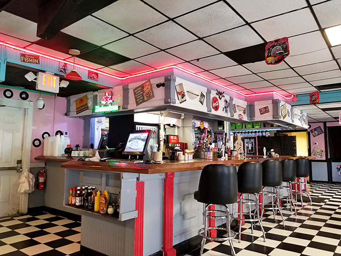 The neon glow bathes everything in a rosy nostalgia that makes even your coffee taste like it's from a simpler, perhaps better time.