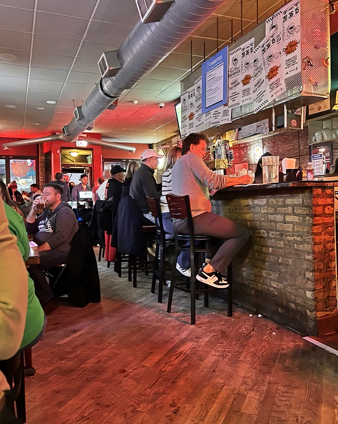 The bar area: where pizza pilgrims gather to worship at the altar of caramelized crust while debating Chicago's greatest sports moments.