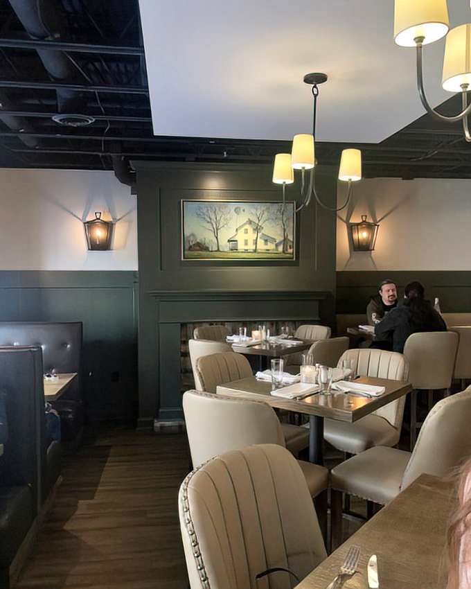 Green walls, cream chairs, and thoughtful lighting create dining spaces that feel both special and comfortable &ndash; like dining in a stylish friend's home.