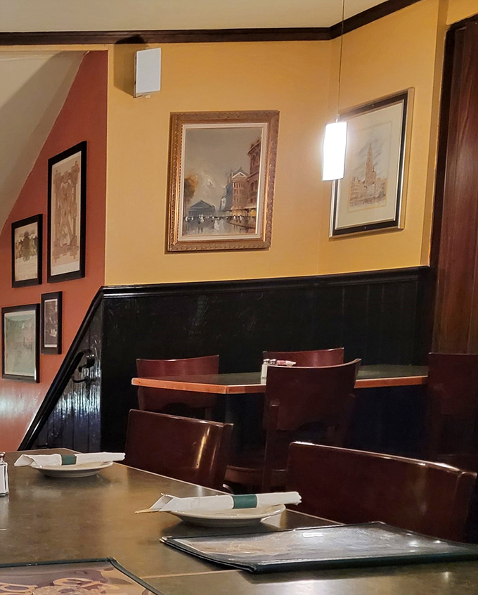 Cozy corner tables where conversations flow as easily as the drinks. The warm color palette isn't accidental&mdash;it's designed to make you feel at home.