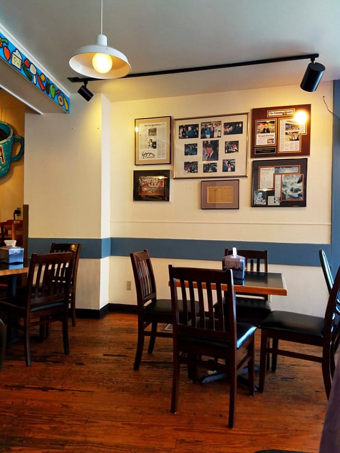 Cream walls adorned with framed memories &ndash; because great delis understand they're not just feeding stomachs, but souls.