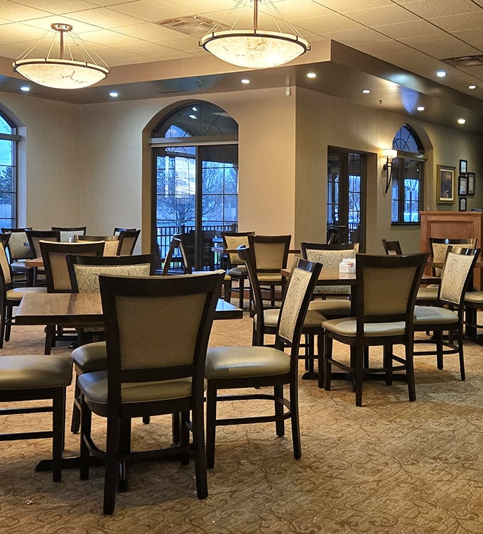 
The thoughtfully designed dining space offers both intimacy and openness, with elegant lighting fixtures that cast a warm glow over every table. 