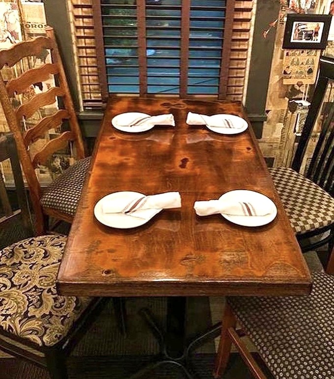 A cozy table for four awaits your party, each place setting a promise of the Mexican flavor journey that's about to unfold.