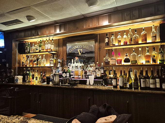 The well-stocked bar showcases an impressive spirits collection. This isn't just a place for steak—it's where bourbon and beef live in harmony.