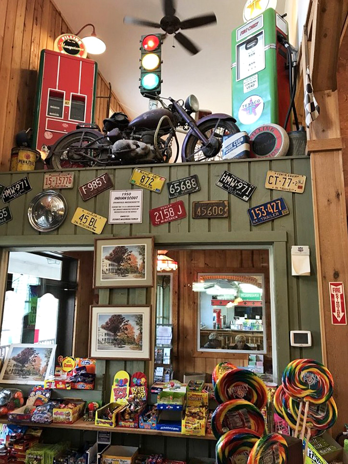 Nostalgia hanging from every rafter. Vintage license plates and a classic motorcycle watch over lollipops that could double as stained glass.